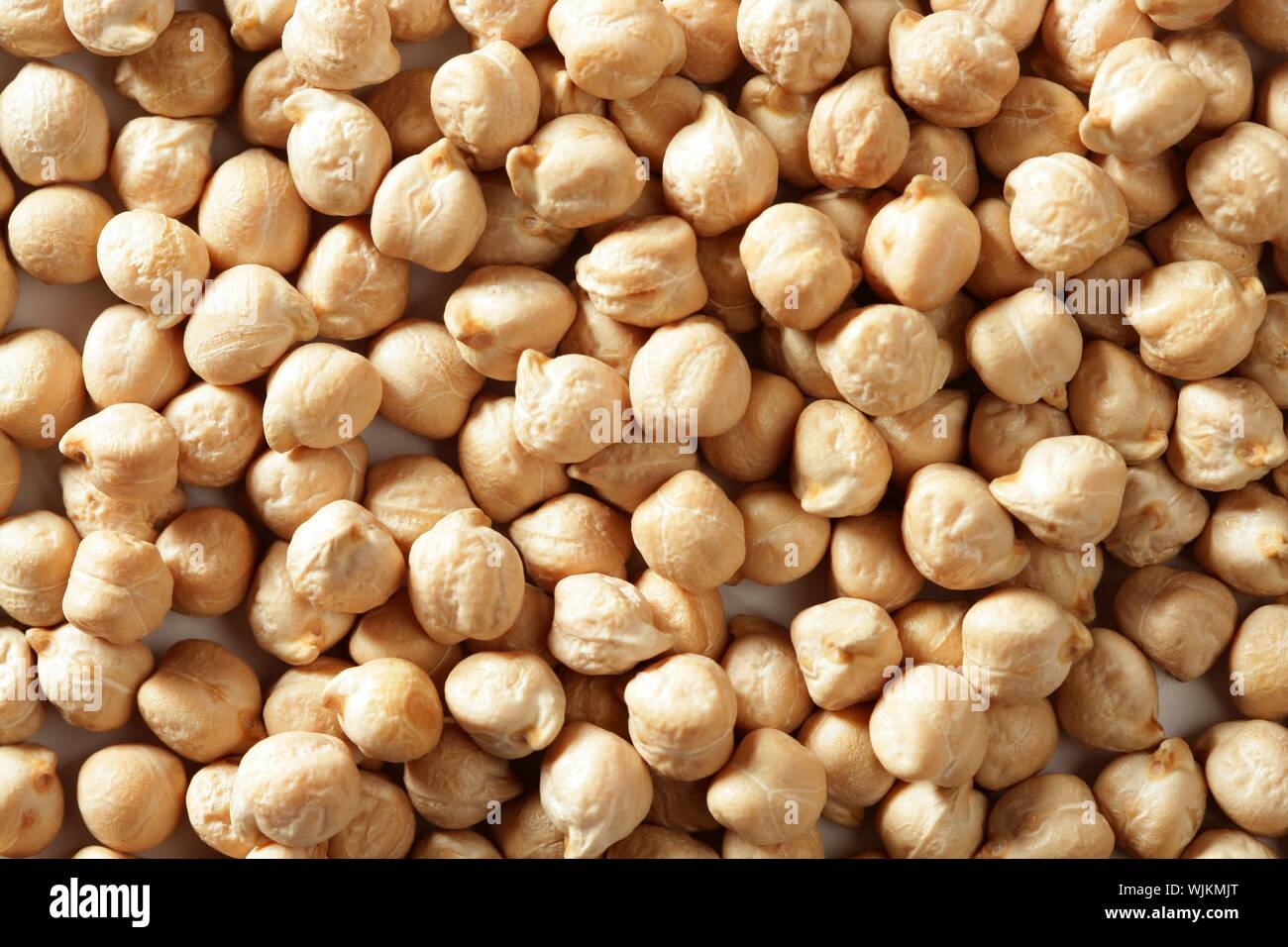 Chickpeas texture background at studio over white Stock Photo - Alamy