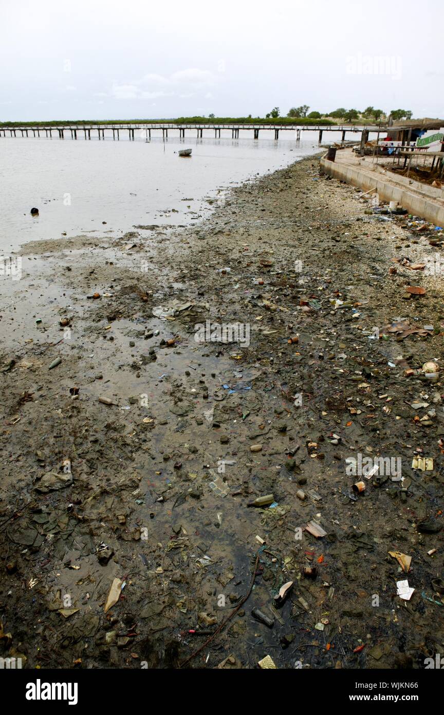 Africa dirty landscape side of river with trash Stock Photo - Alamy