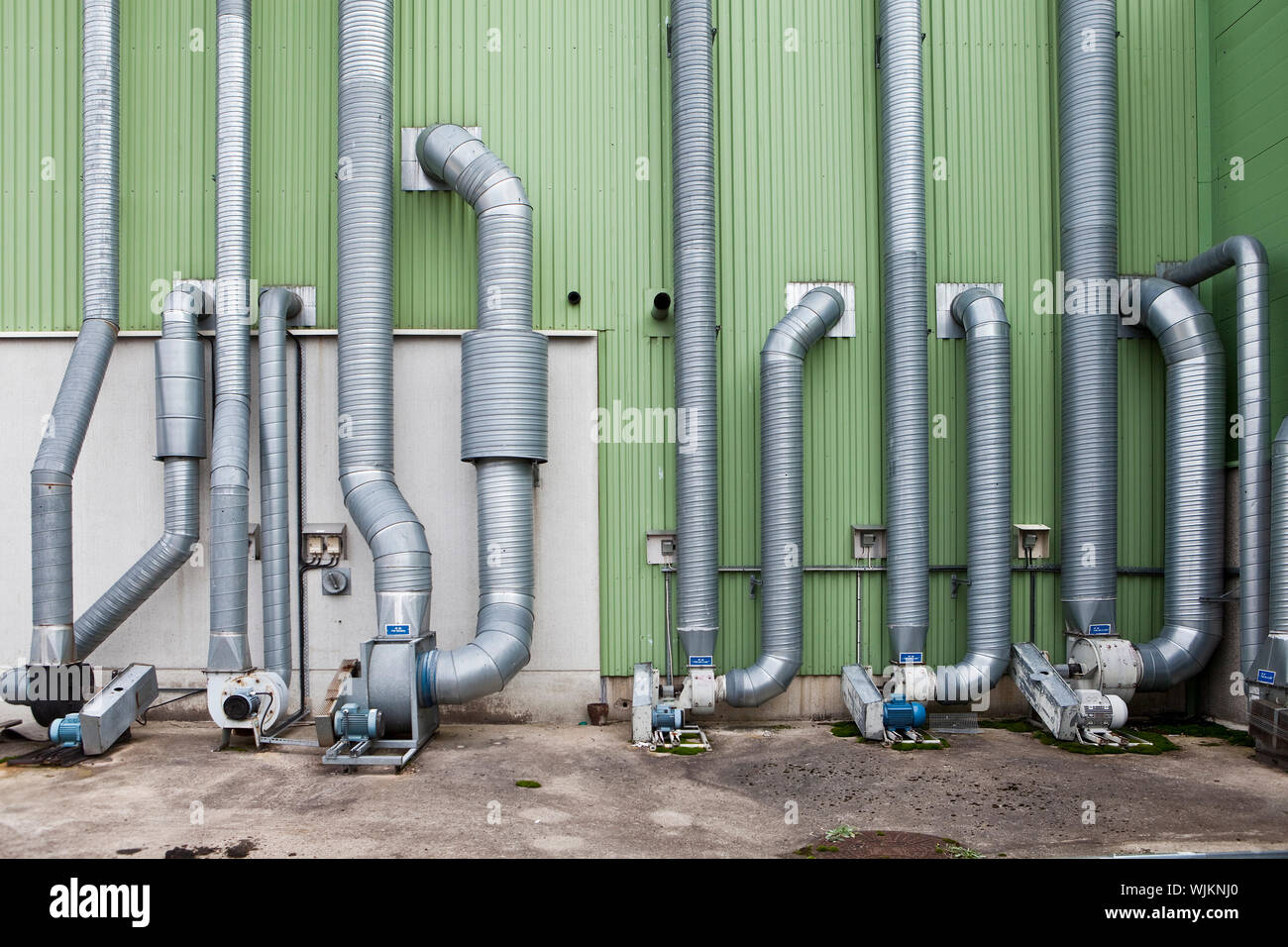 Industry pipes outside a warehouse building Stock Photo - Alamy