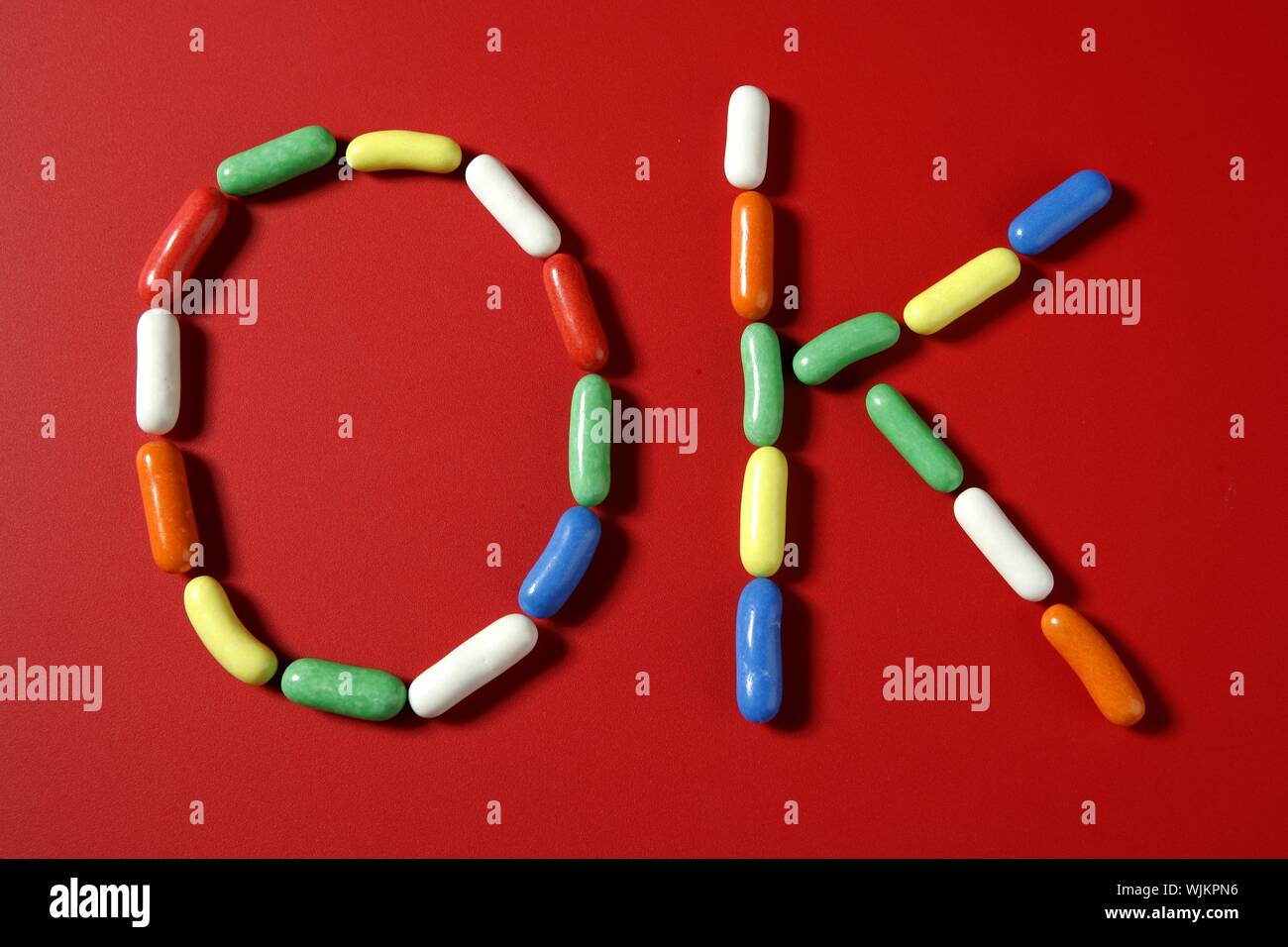 Candy colorful sweets with letter shapes spelling the word OK Stock ...
