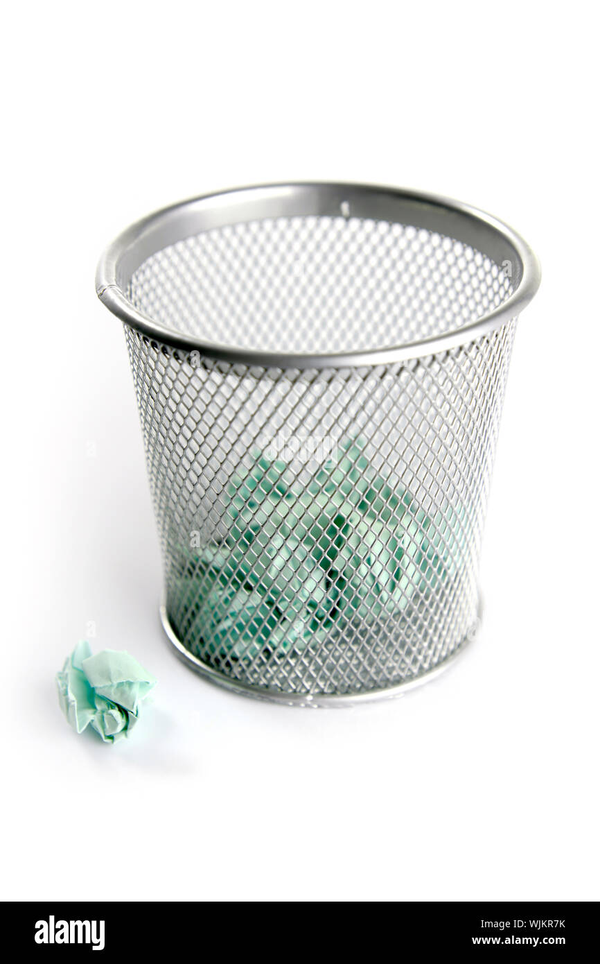 Crumpled paper into dustbin Cut Out Stock Images & Pictures - Alamy