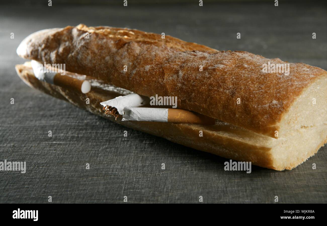 Cigarette bread sandwich menu, tobacco addiction metaphor Stock Photo ...