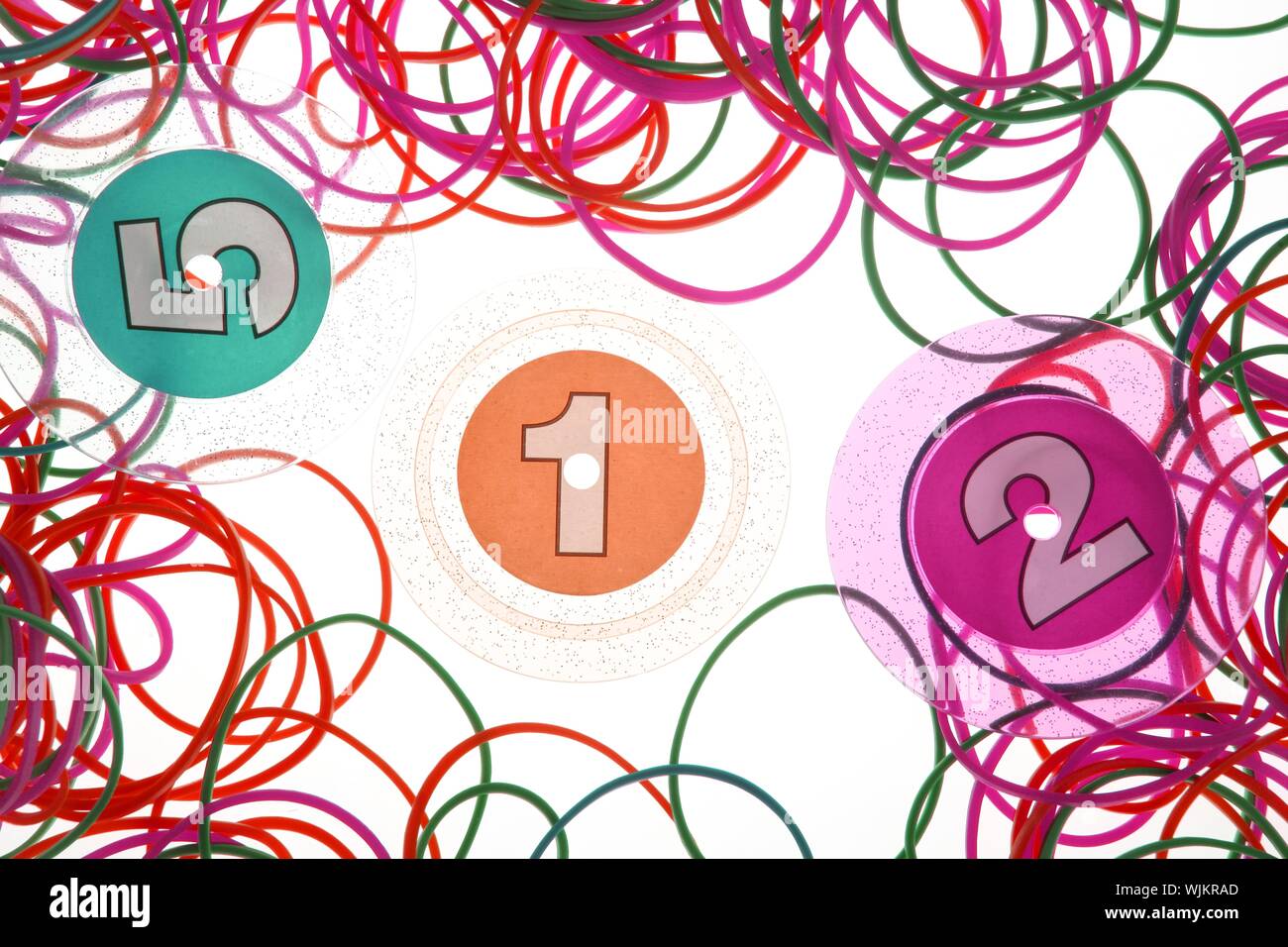 Colorful texture of rubber bands and disks with numbers Stock Photo - Alamy