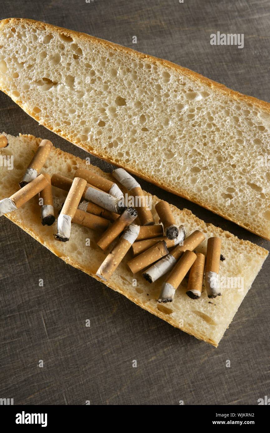 Cigarette bread sandwich menu, tobacco addiction metaphor Stock Photo ...