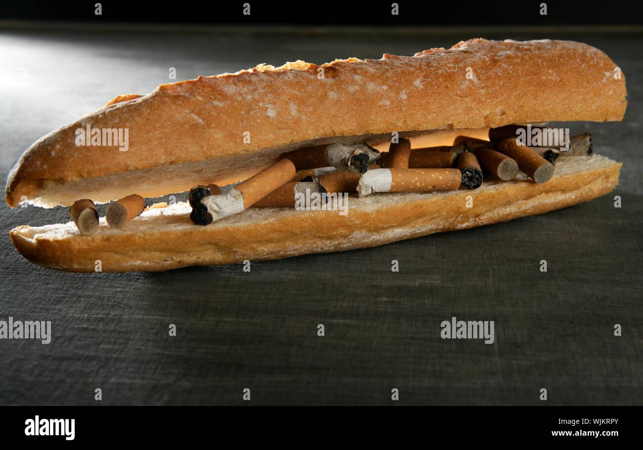 Cigarette bread sandwich menu, tobacco addiction metaphor Stock Photo ...