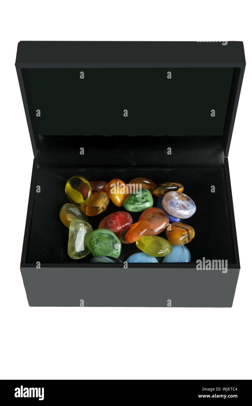 Colorful glass stones in a black box like a fake treasure chest Stock ...