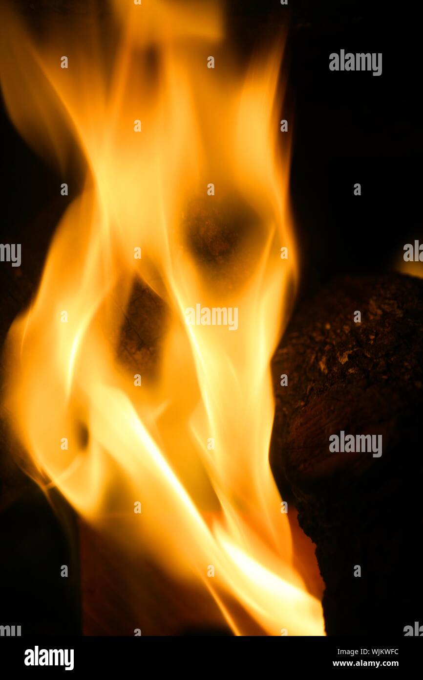 Orange fire burning flames over black background Stock Photo - Alamy
