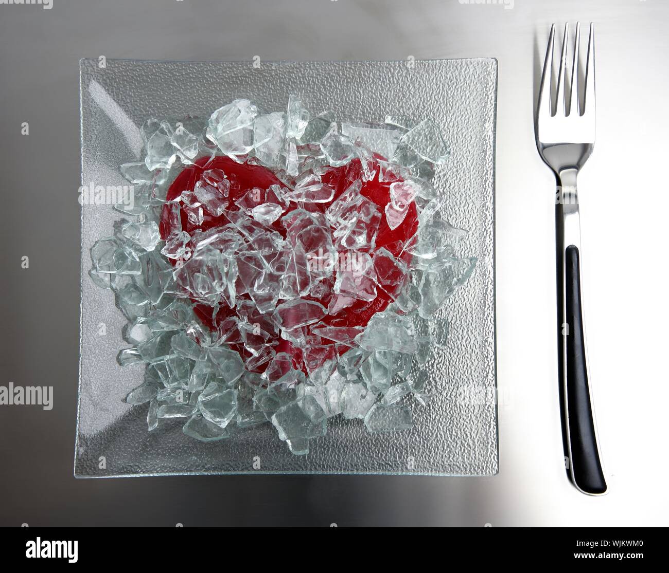Menu for today: broken glass sweet candy heart Stock Photo - Alamy