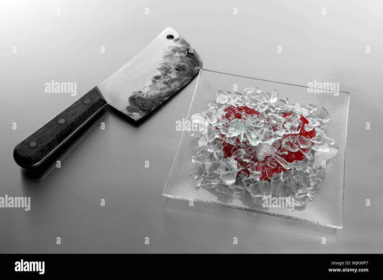 Broken sweet candy red heart with bloody knife, the murder weapon Stock ...