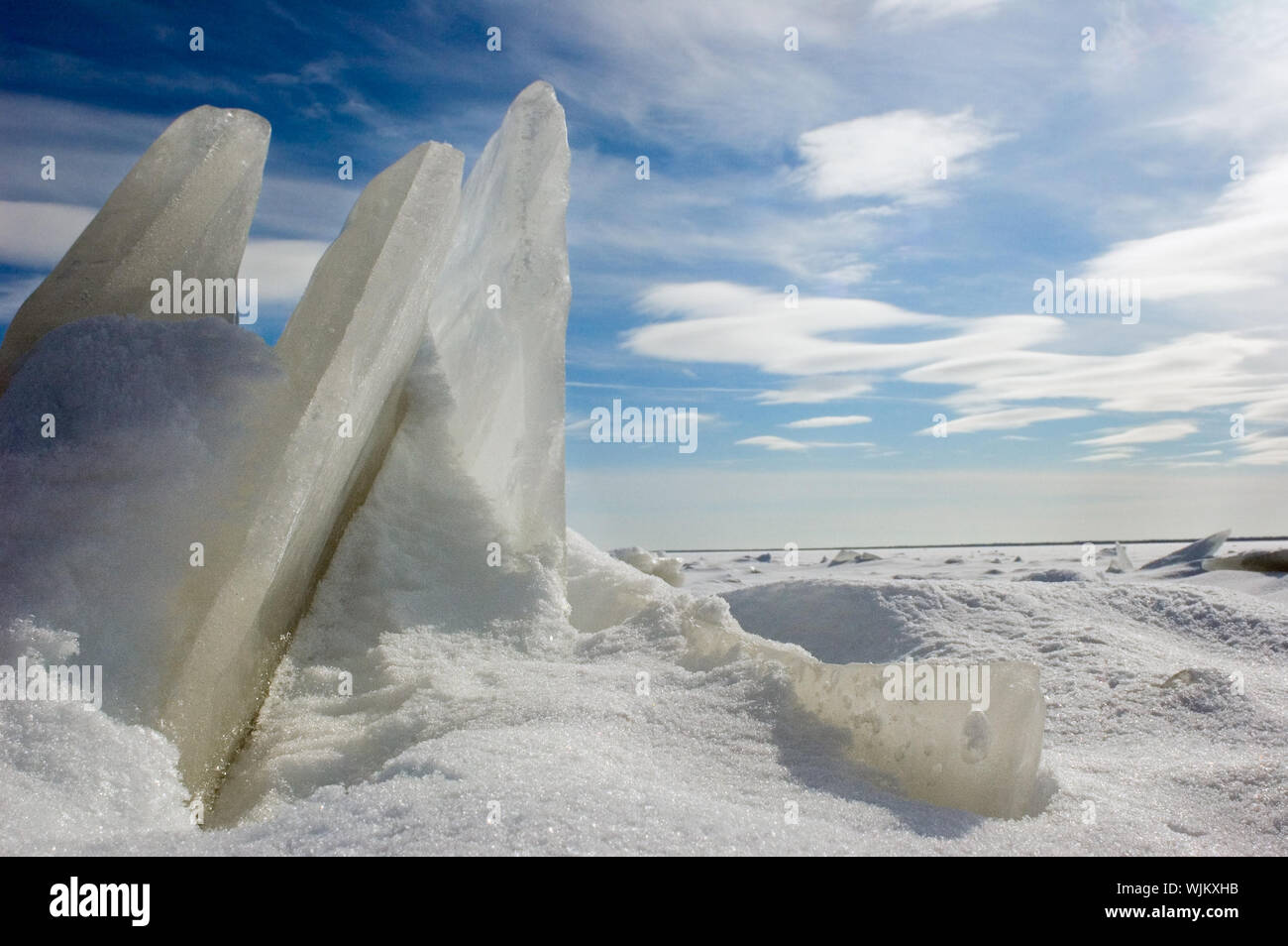 Chipped ice sharp peaks sticks out upwards. Clear frosty day. Russia ...