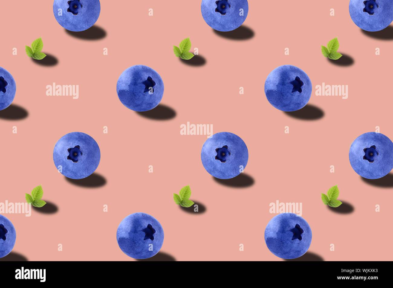 Blue whole blueberry pattern on colorful background Stock Photo - Alamy