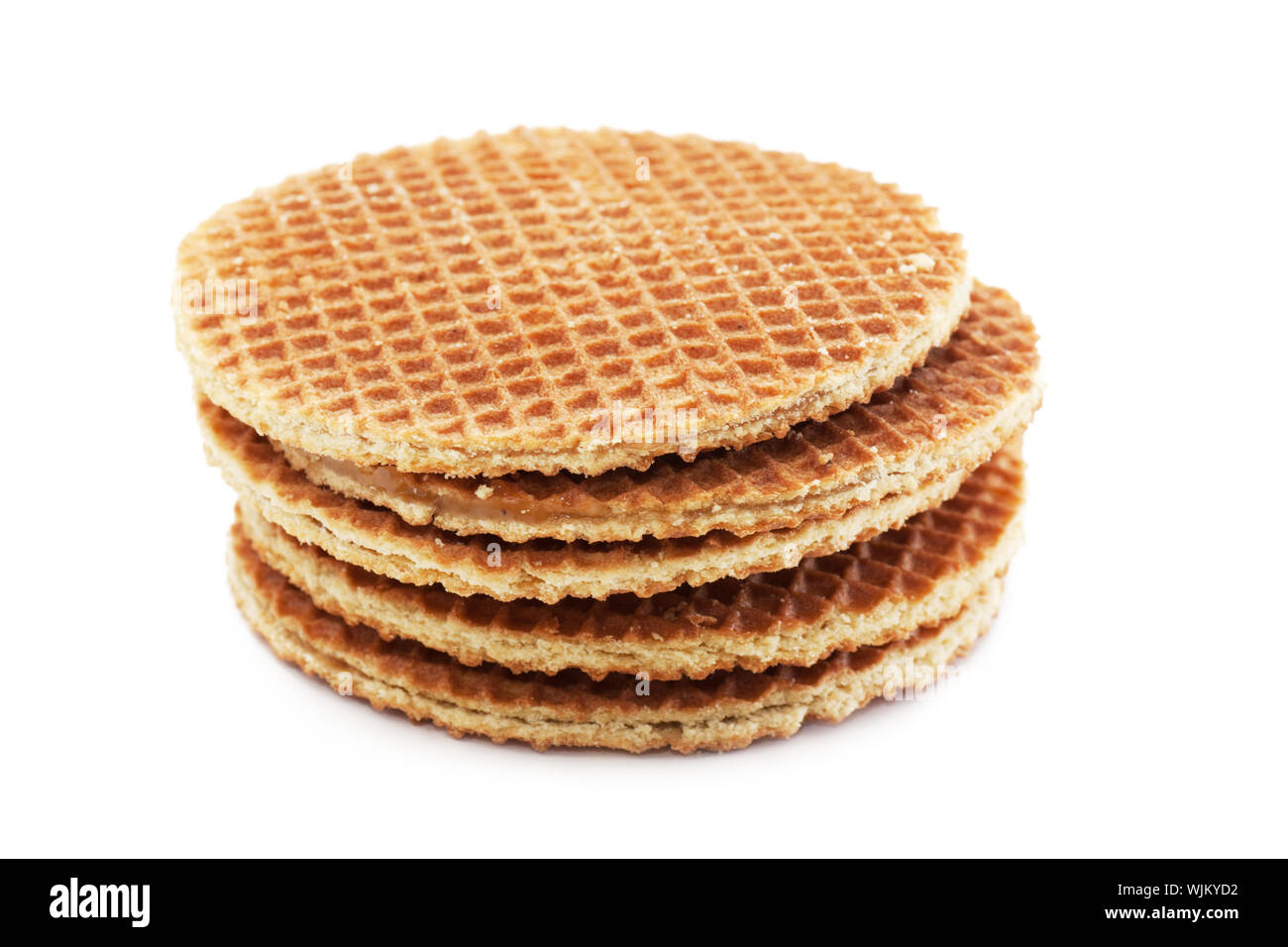 A stack of golden round waffles isolated over white background Stock ...