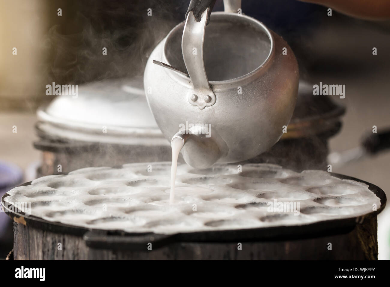 Heat milk on stove hi-res stock photography and images - Alamy