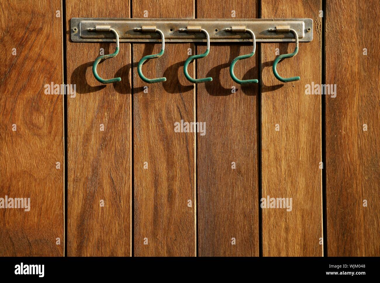 Rural hanger over wooden wall, horse stables Stock Photo - Alamy