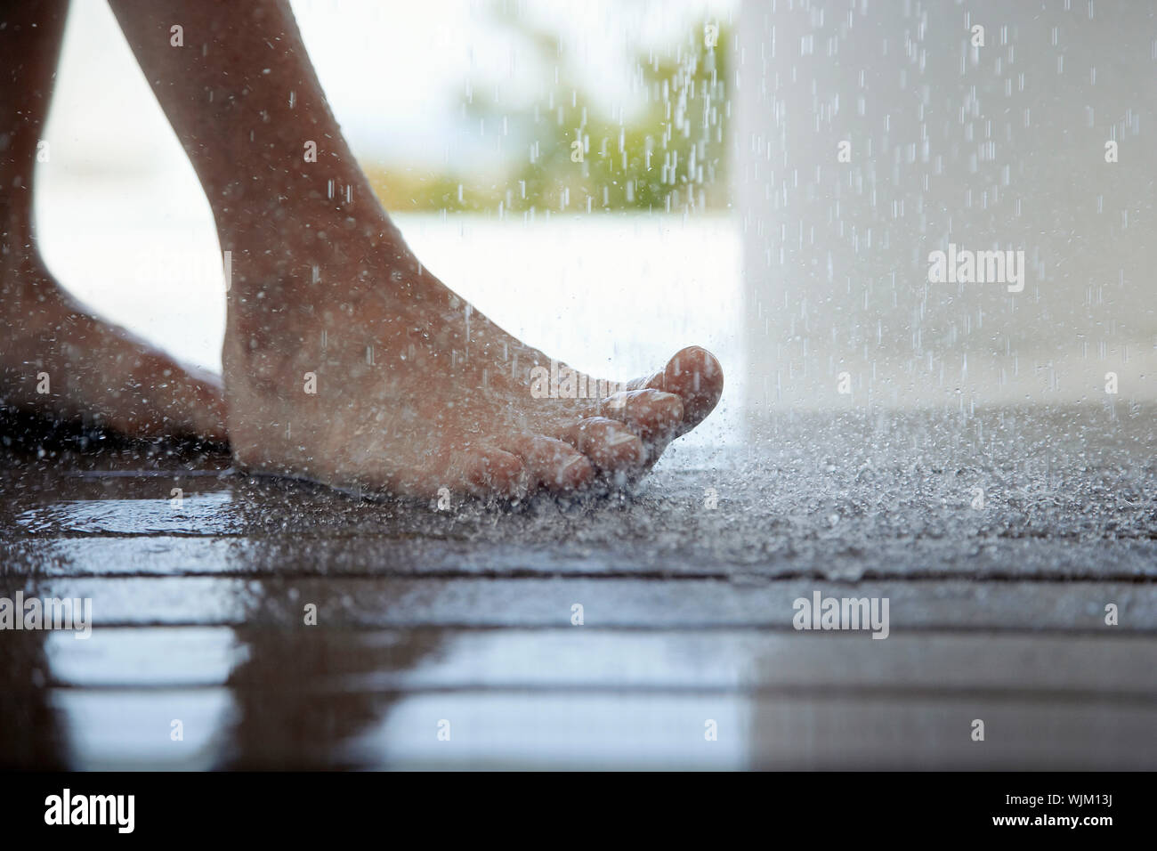 Foot Under Dripping Water Stock Photo - Alamy