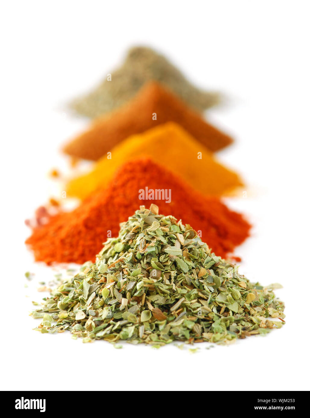 Heaps of various ground spices on white background Stock Photo - Alamy