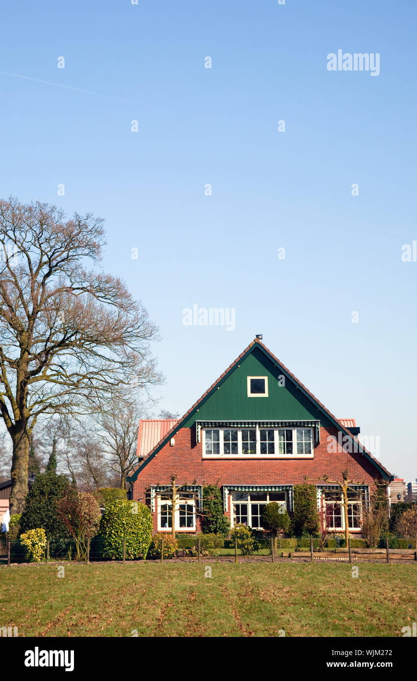 Dutch farmhouse with grass fields in front Stock Photo - Alamy