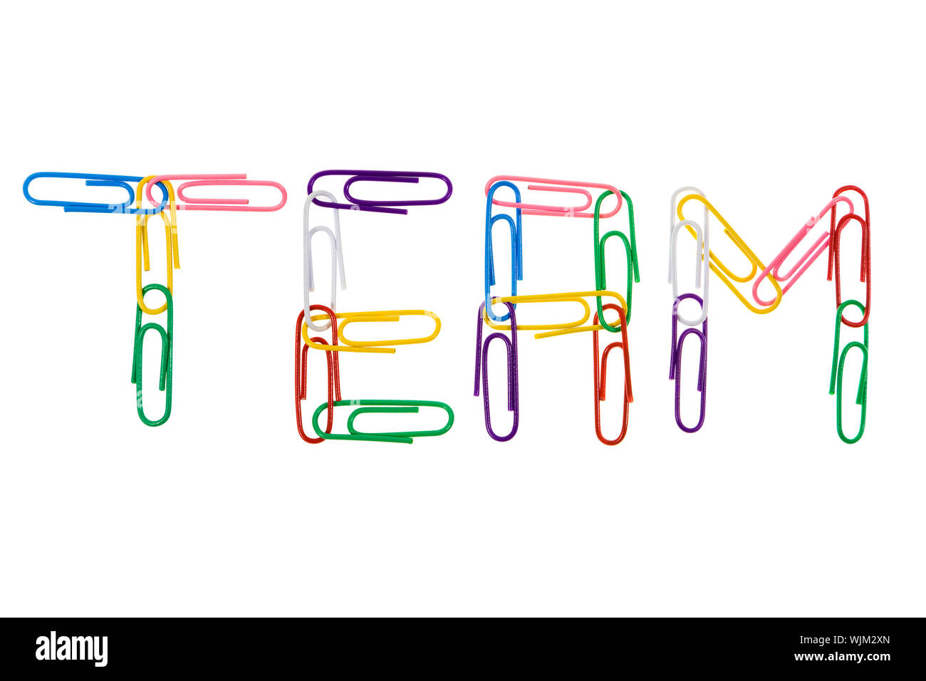 word "team" made with multicolored paper clips joined together on white ...