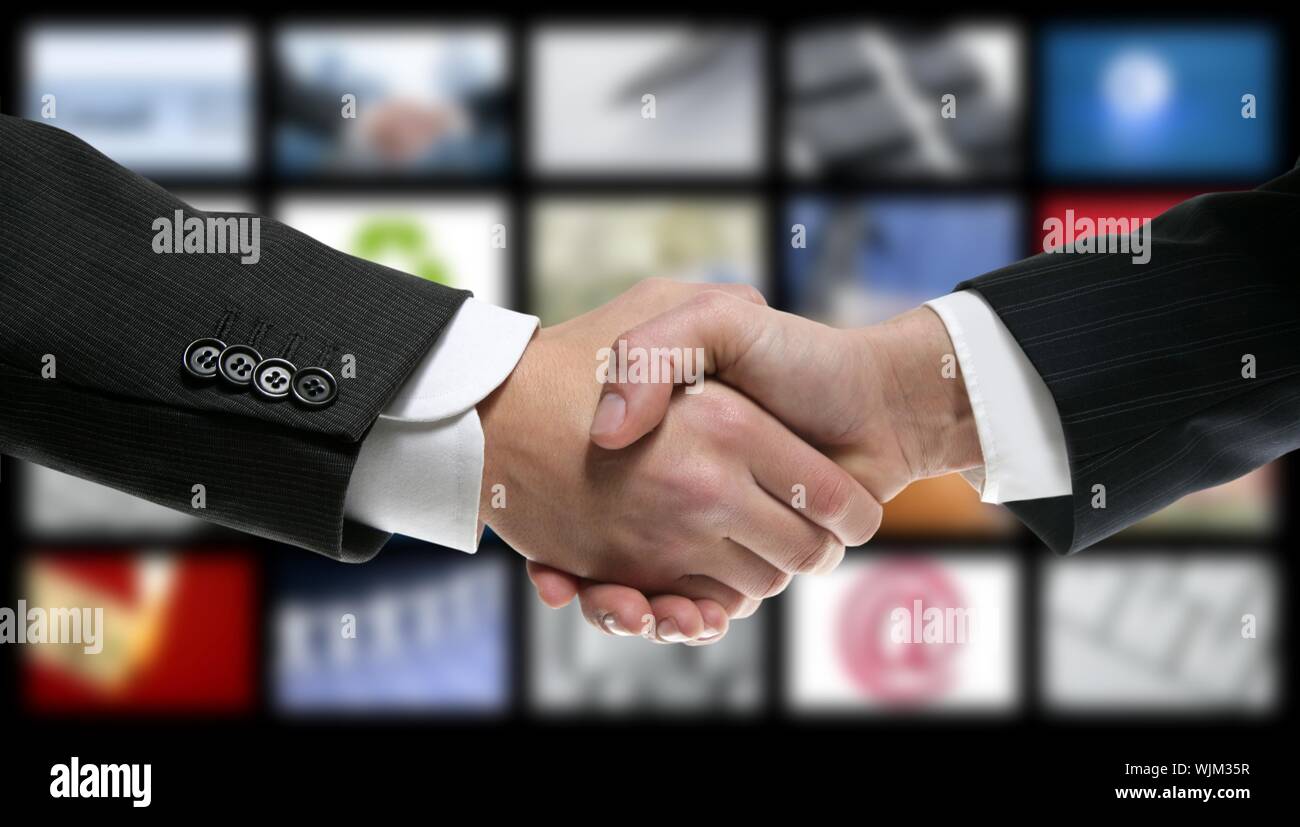 handshake over video tv screen technology and communication background ...