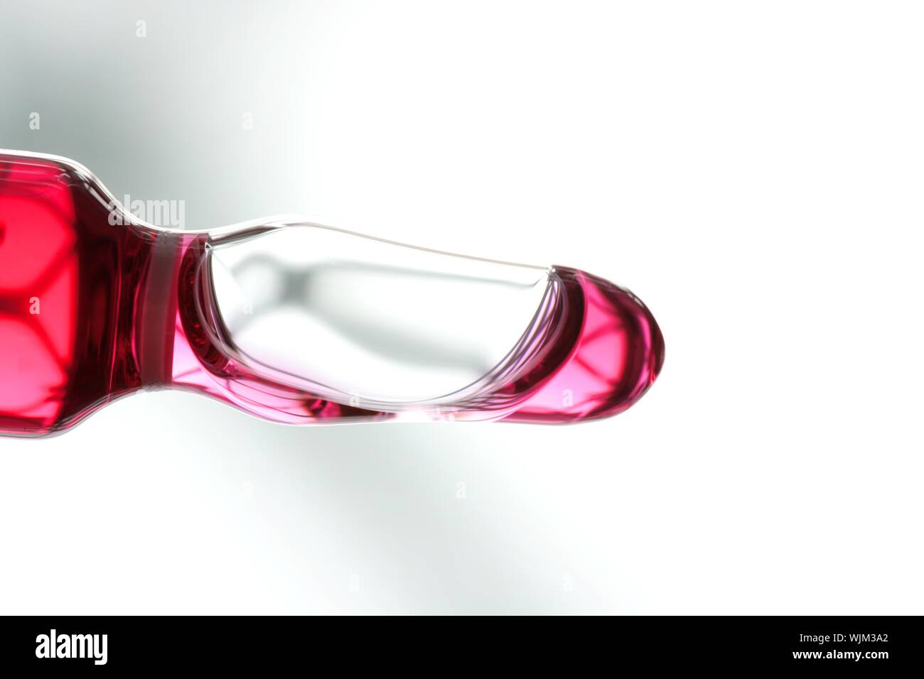Glass ampoule with red liquid medicine inside Stock Photo - Alamy