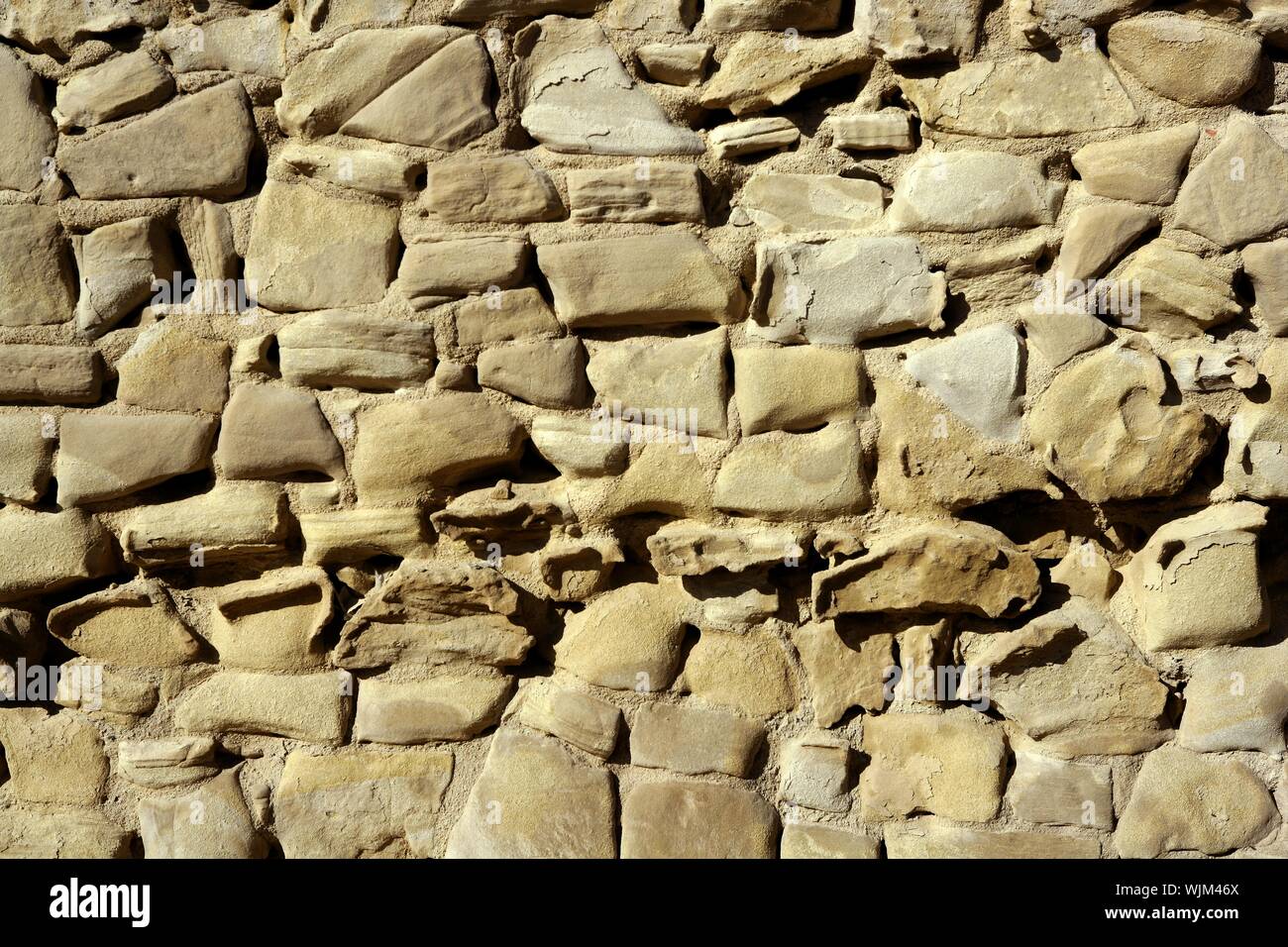 Aged stone walls, masonry architecture backgrounds, Spain Stock Photo ...