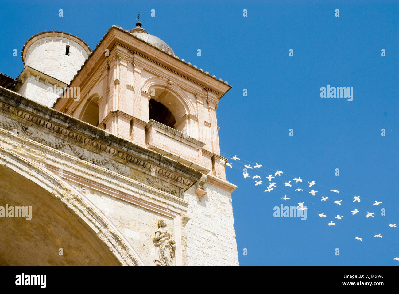Basilica of Saint Francis in Assisi with doves as a symbol of peace ...