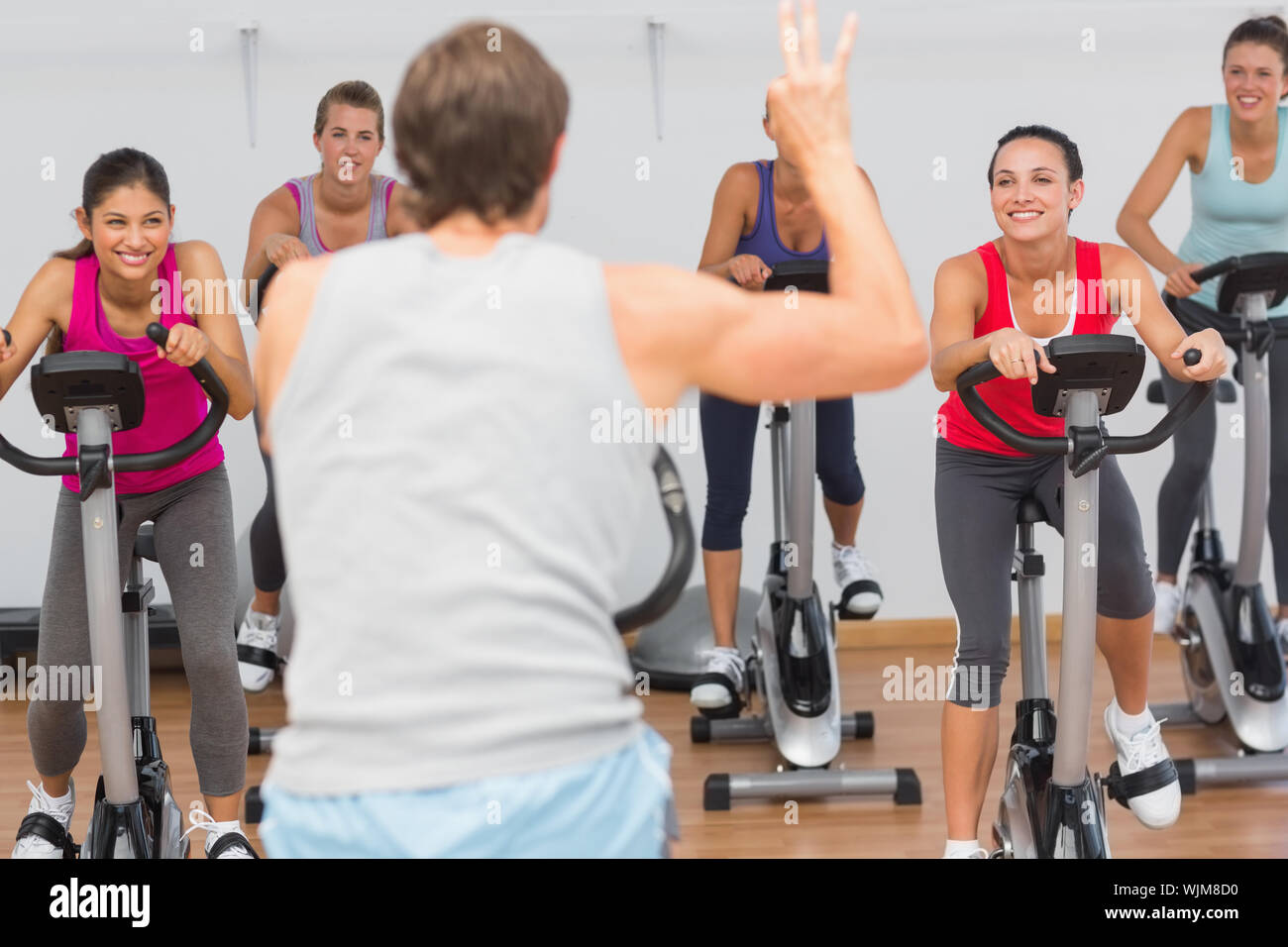 Spinning class in fitness studio hi-res stock photography and images ...
