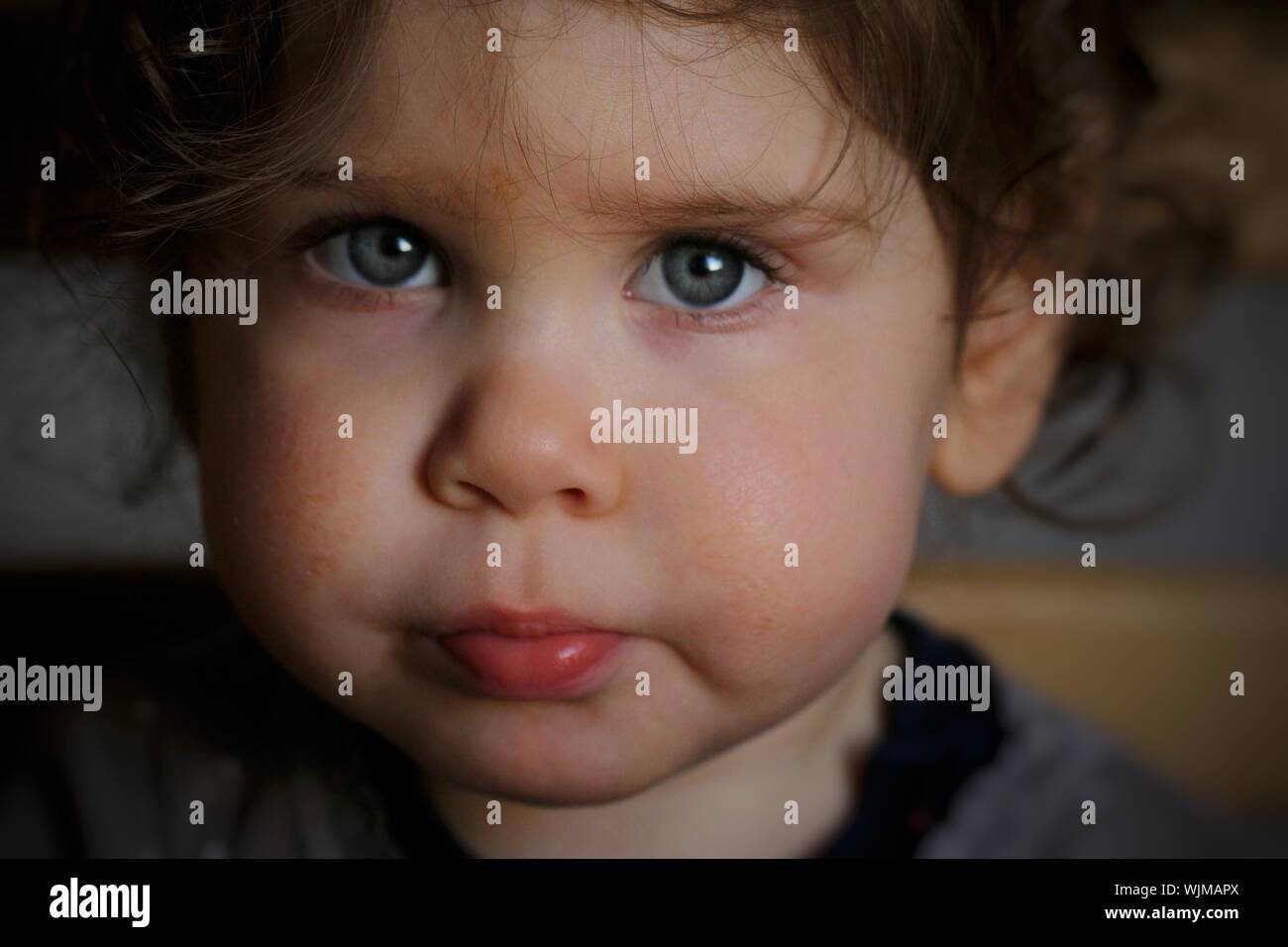 Serious baby girl hi-res stock photography and images - Alamy