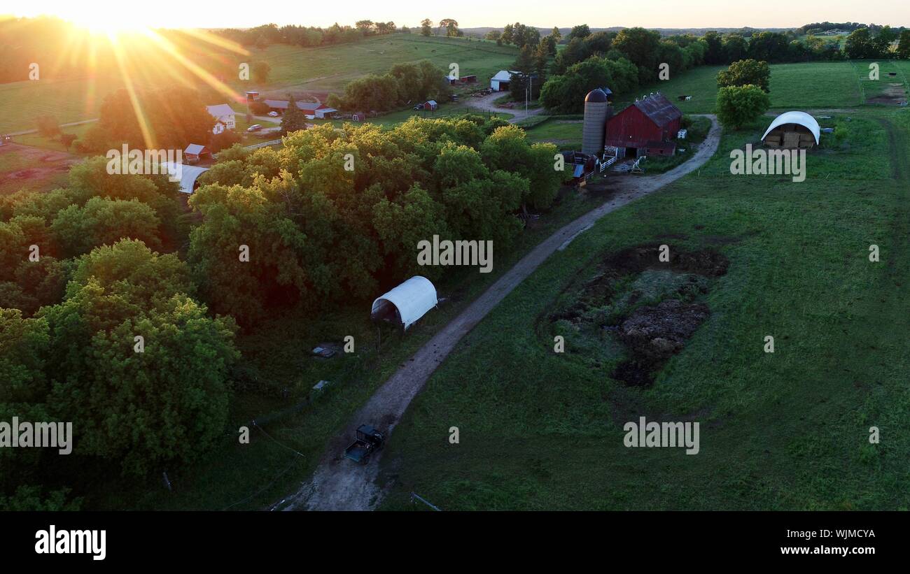 Aerial view at sunset over Brattset Family Farm, an organic beef farm ...