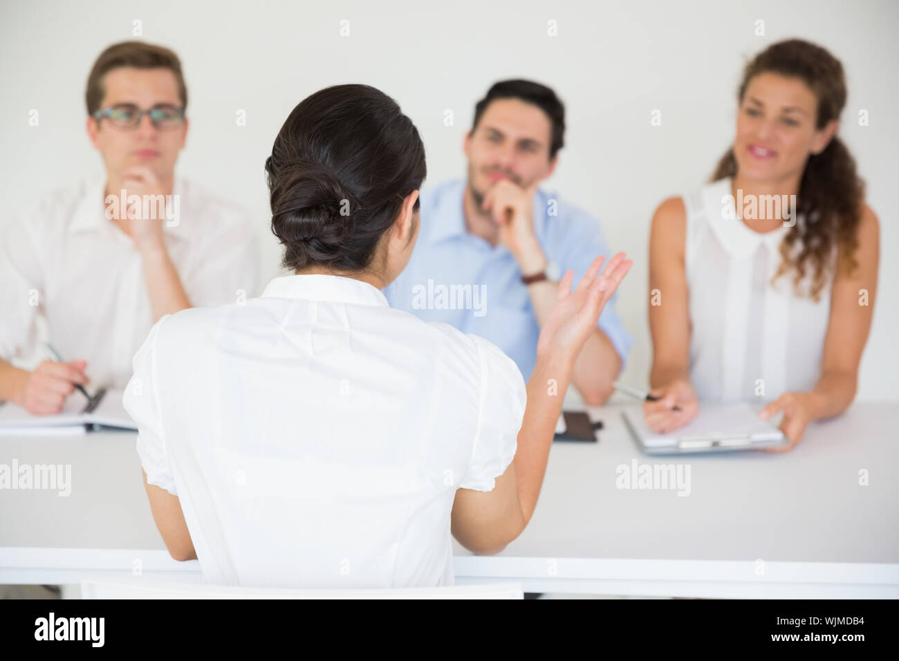 Female candidate having an interview in office Stock Photo - Alamy