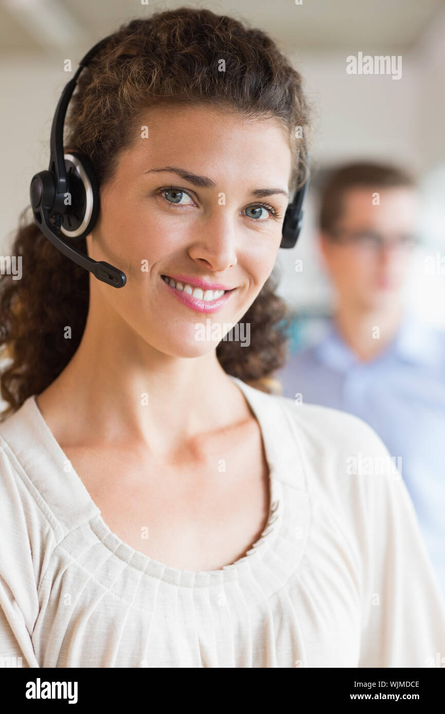 Closeup portrait of female customer service operator wearing headset in ...