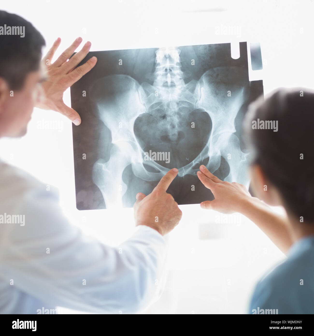 Nurse and doctor examining xray in hospital Stock Photo - Alamy