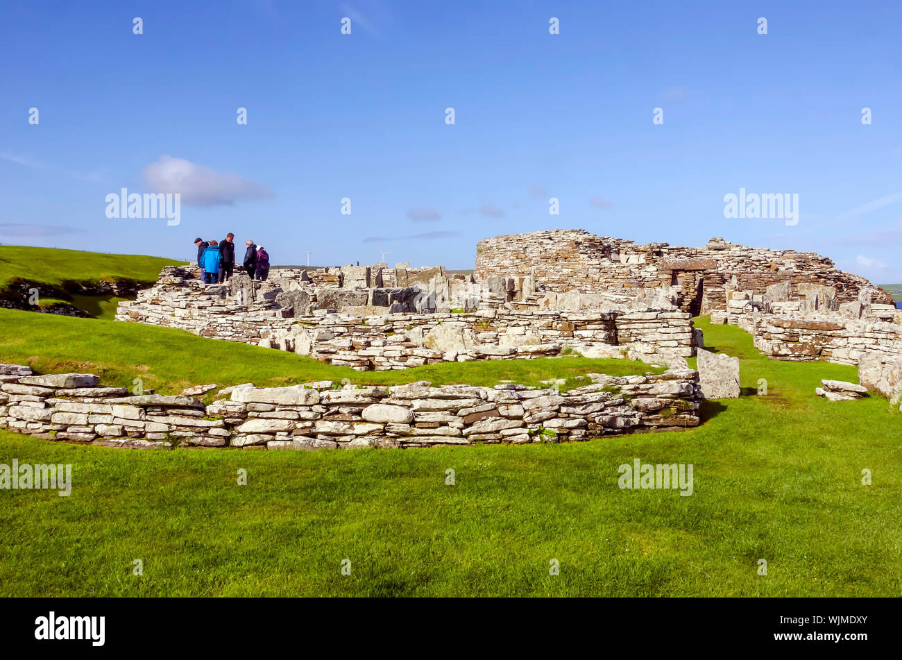 Broch of Gurness flanked by earth banks reinforced by stone. The broch ...