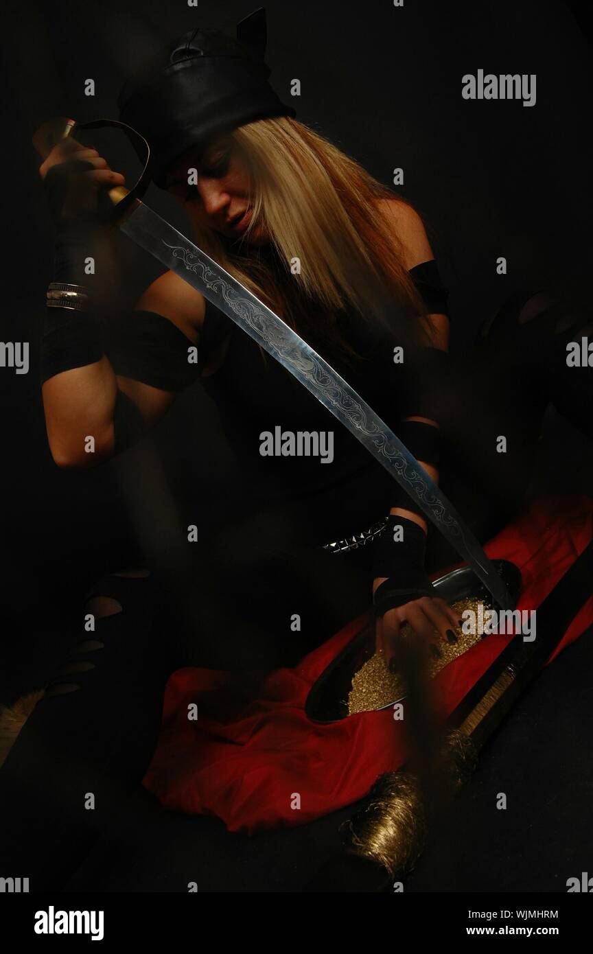 Young warrior woman holding sword hi-res stock photography and images ...