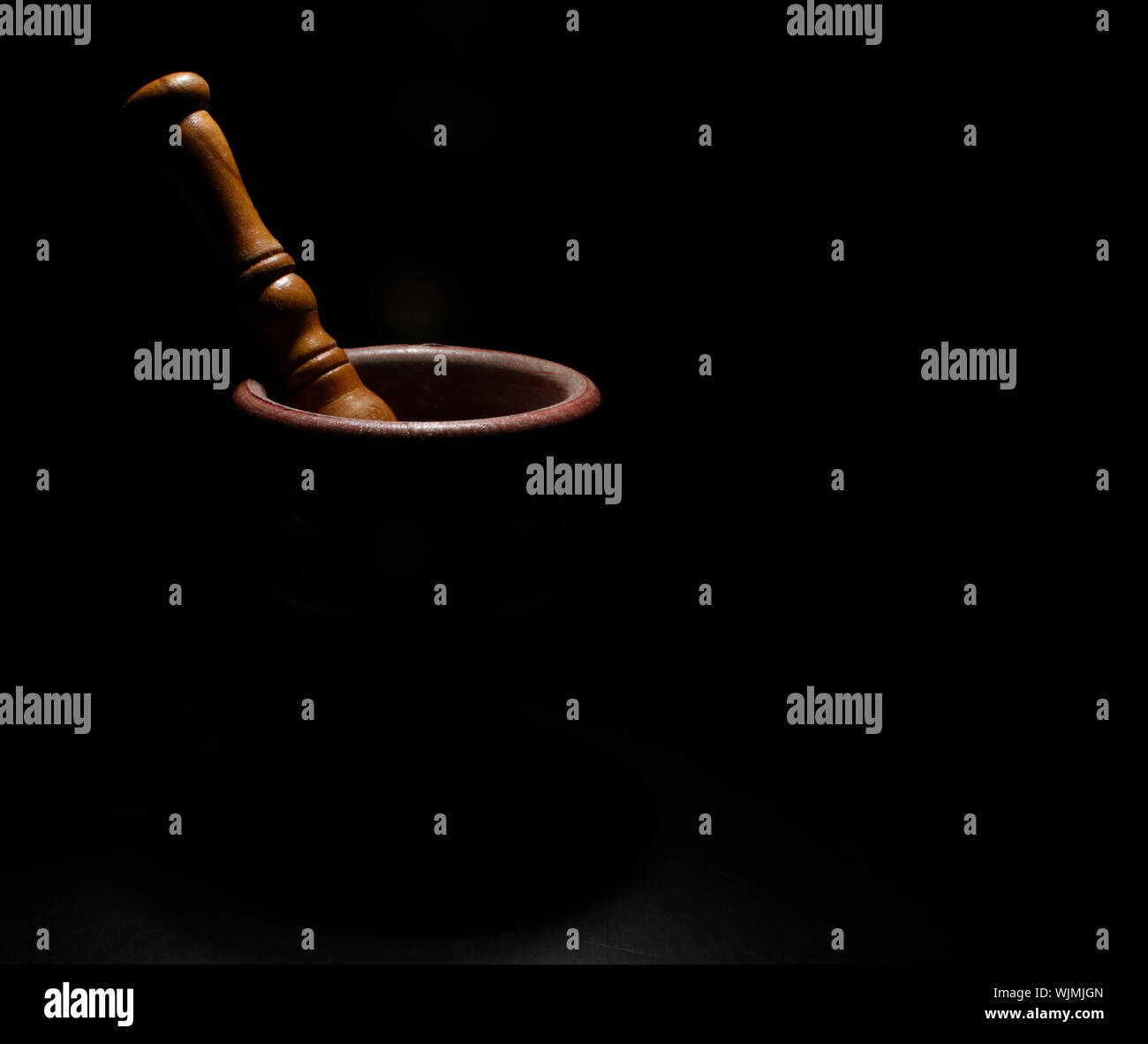 Mortar. Black background. isolated. Six dark. Light shoots from above ...