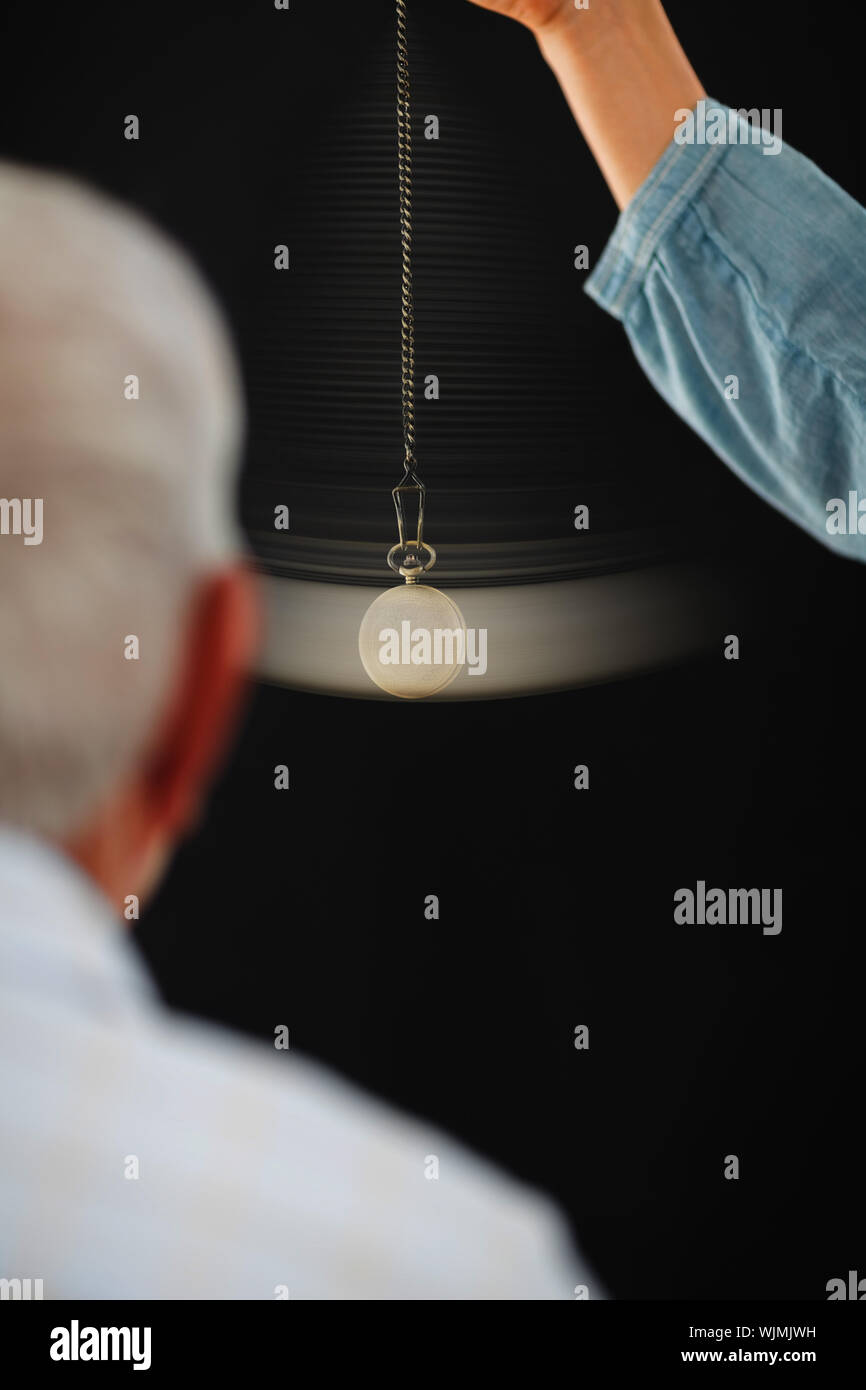 Hypnotizing hand hi-res stock photography and images - Alamy