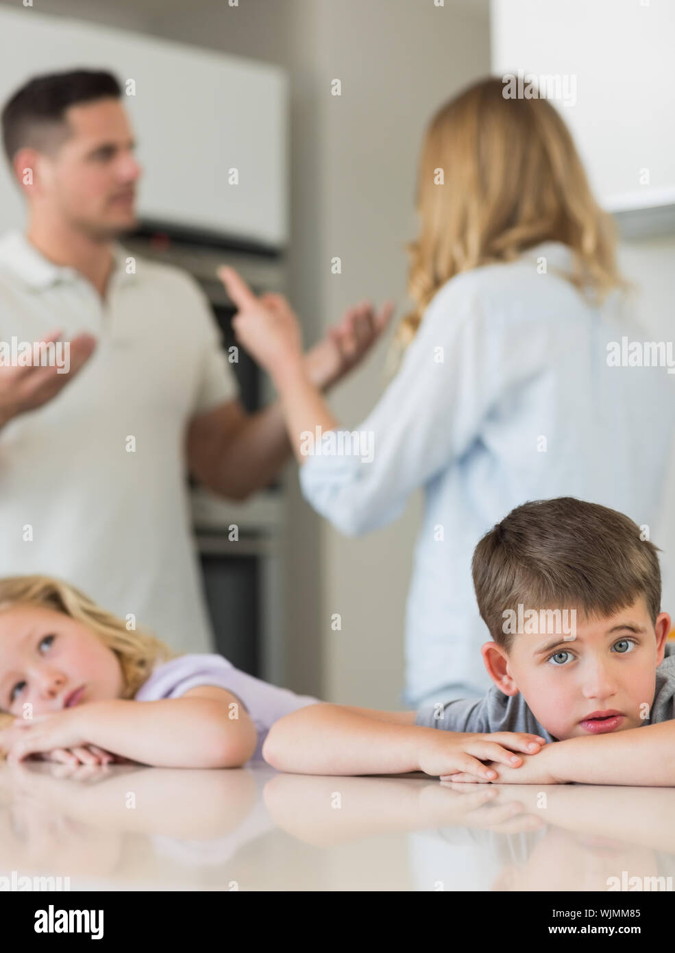Children leaning on table parents hi-res stock photography and images ...