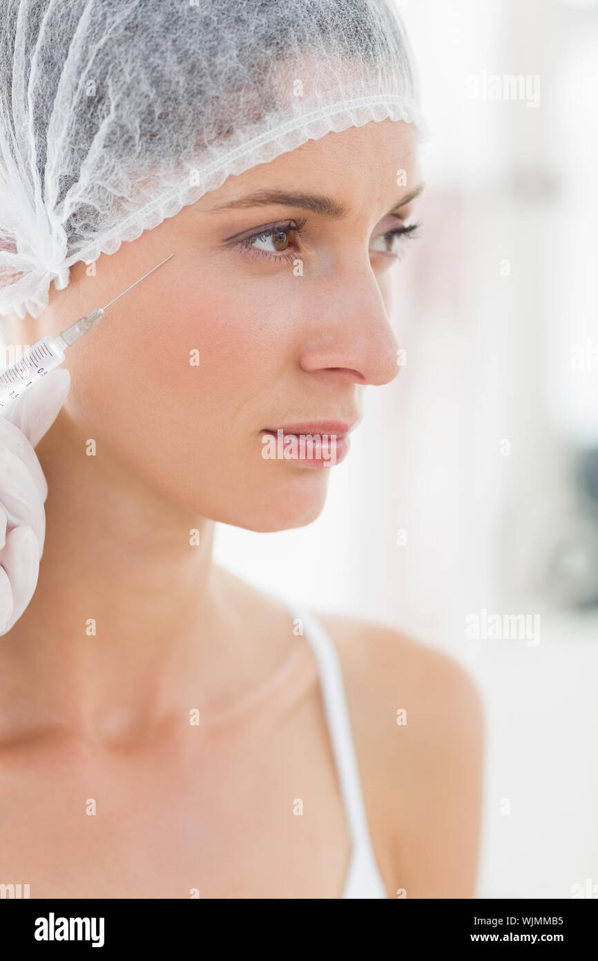 Closeup of beautiful woman having botox injection in clinic Stock Photo ...