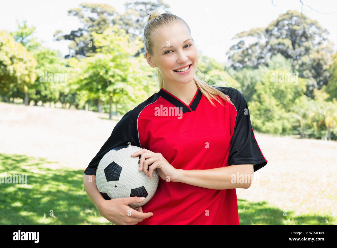 Portrait happy caucasian female soccer hi-res stock photography and ...