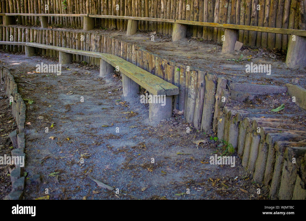 Wooden seat in the woods. There's seats on every floor Stock Photo - Alamy