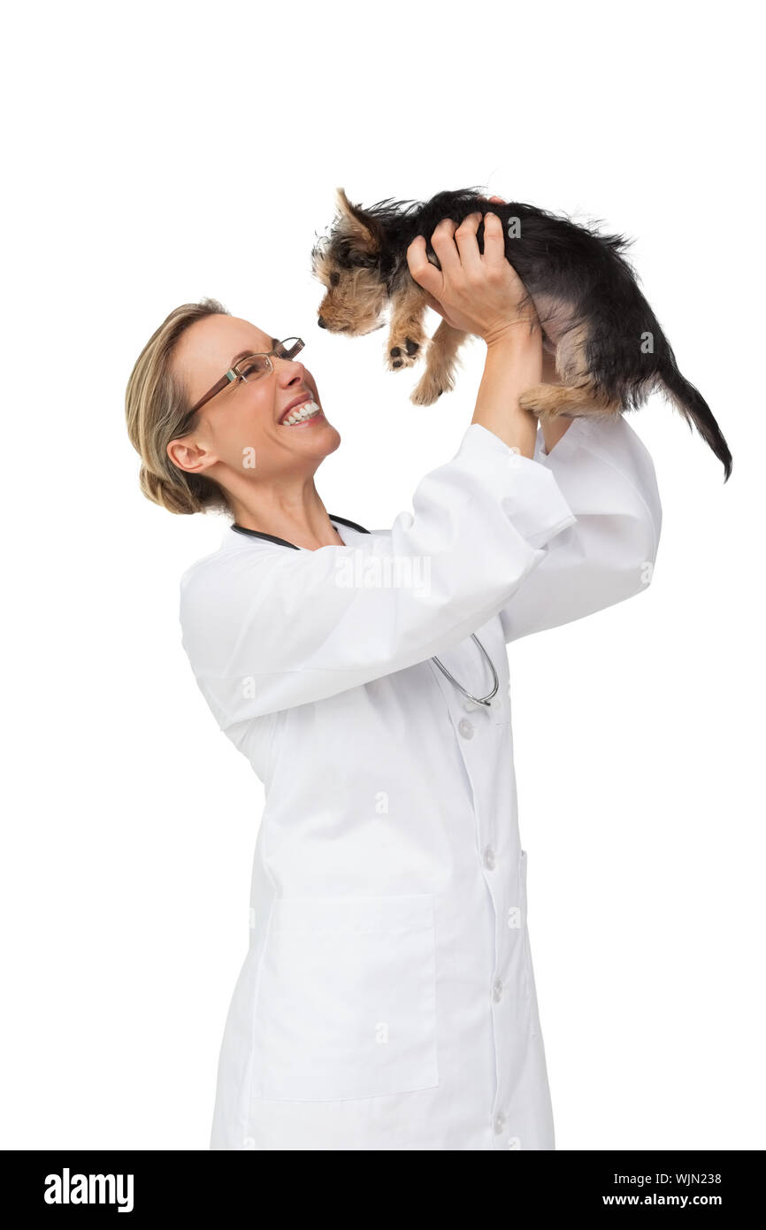 Smiling woman lifting dog hi-res stock photography and images - Alamy
