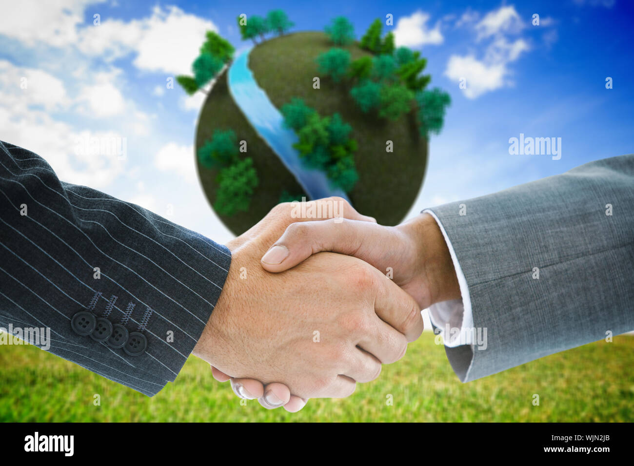 Composite image of business handshake against futuristic earth floating ...