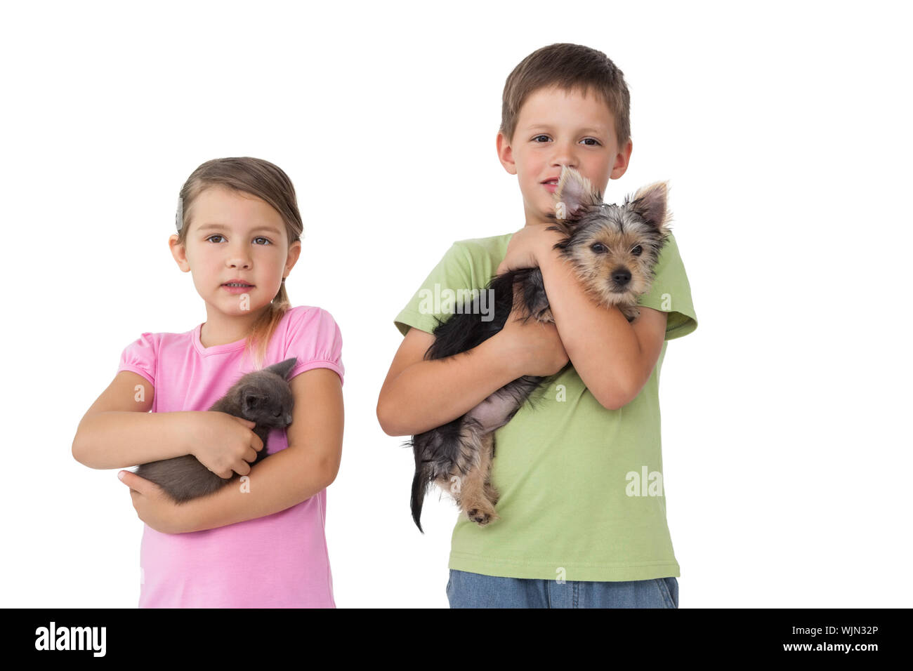 Cute siblings holding pets hi-res stock photography and images - Alamy