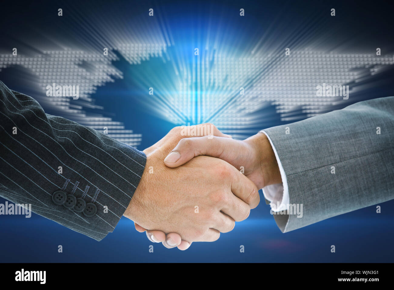 Composite image of business handshake against glowing world map on ...