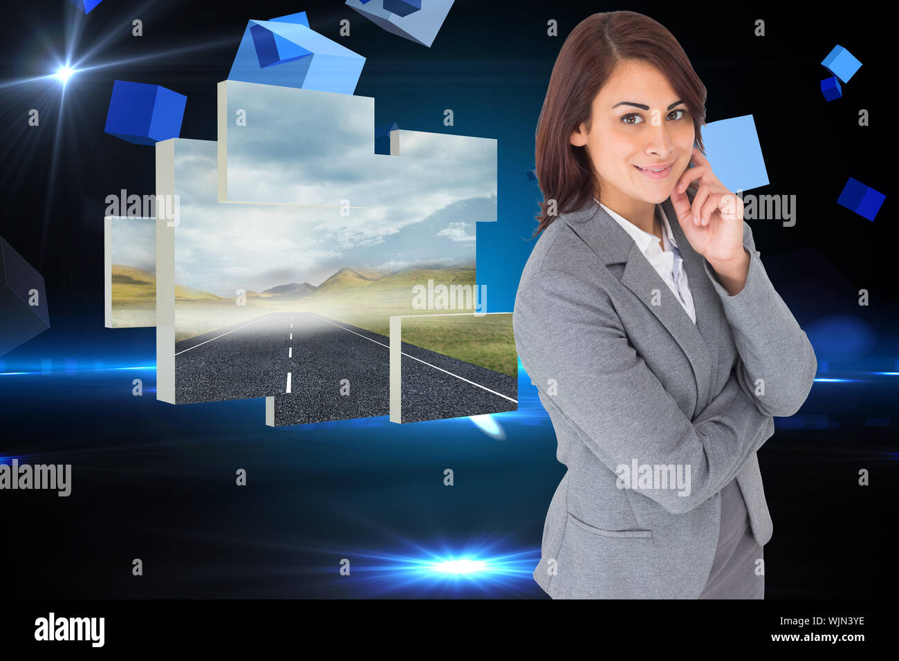 Smiling thoughtful businesswoman against boxes on technical background Stock Photo - Alamy