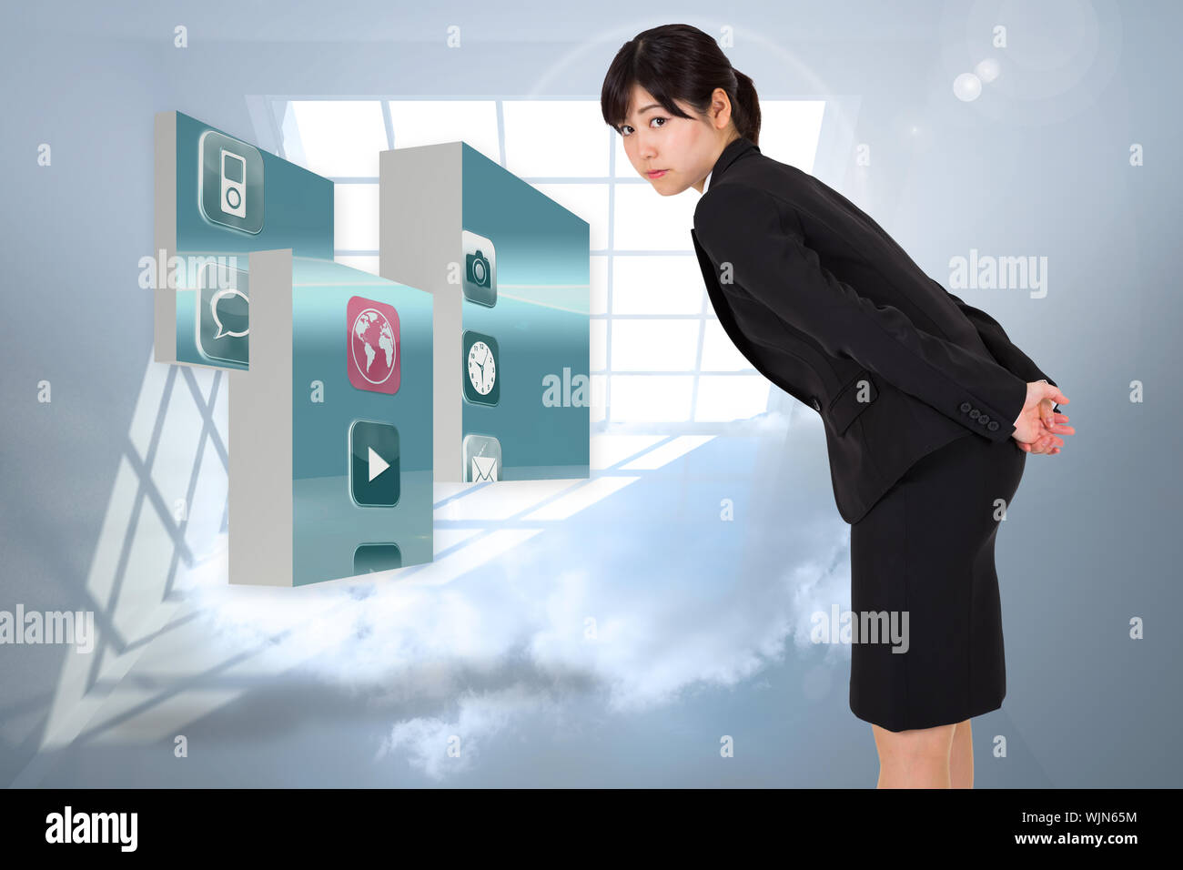 Serious businesswoman bending against room with holographic cloud Stock ...