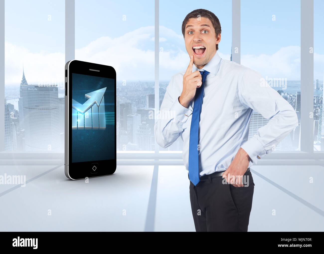 Thinking businessman touching his chin against bright white room with ...