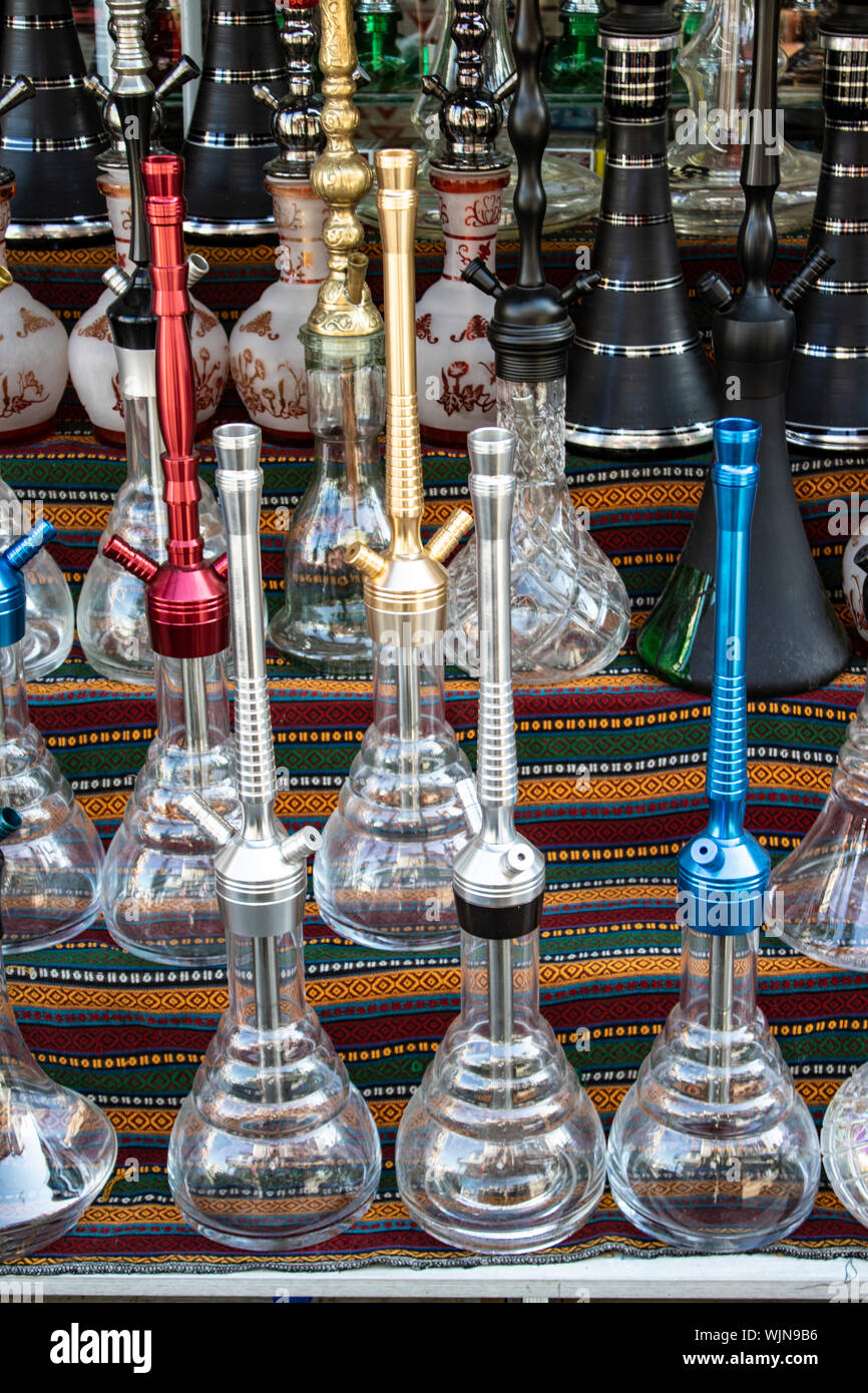 Traditional hookah machines. Stands on the shelf in different colors ...