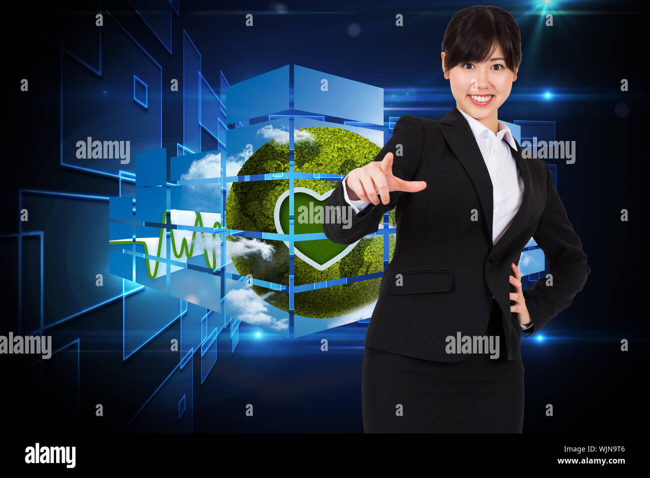 Smiling businesswoman pointing against black background with shiny squares Stock Photo - Alamy