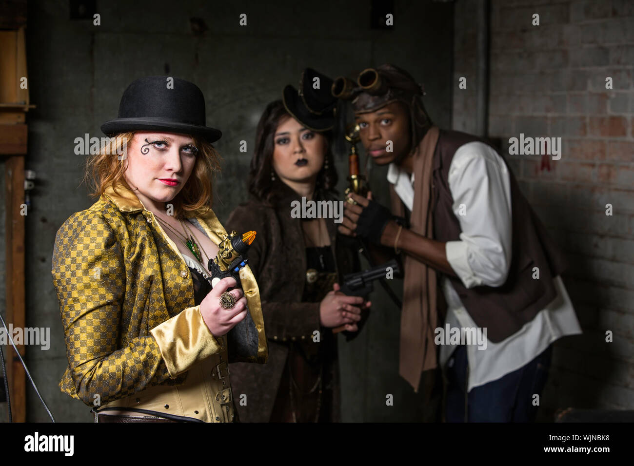 Steam Punks in Underground Lair with Weapons Stock Photo - Alamy